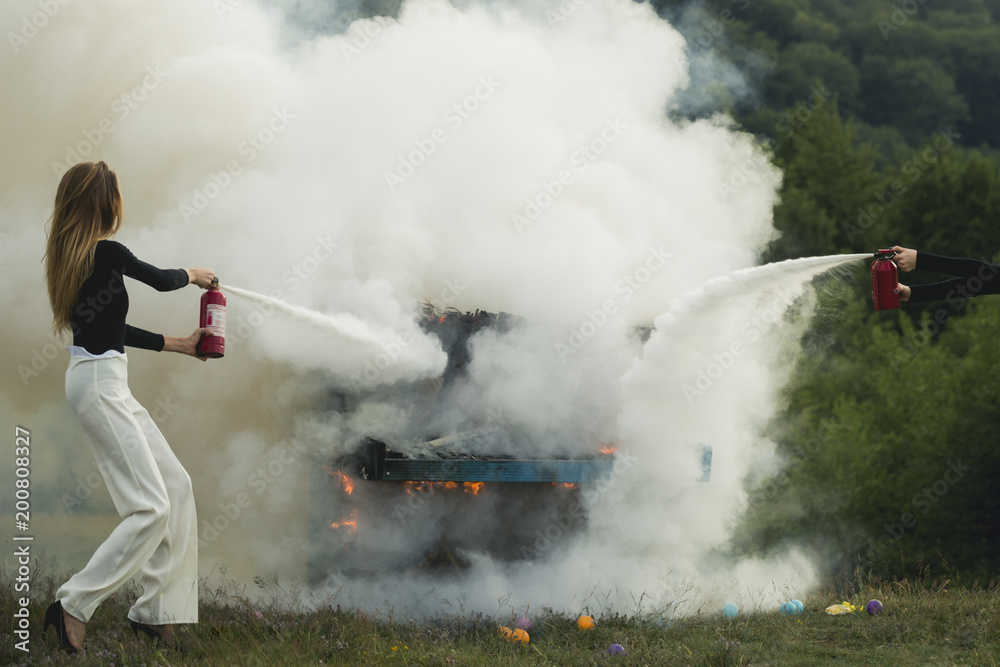 Foto de Stock Fire and smoke on grunge instrument. Firefighting of girl ...