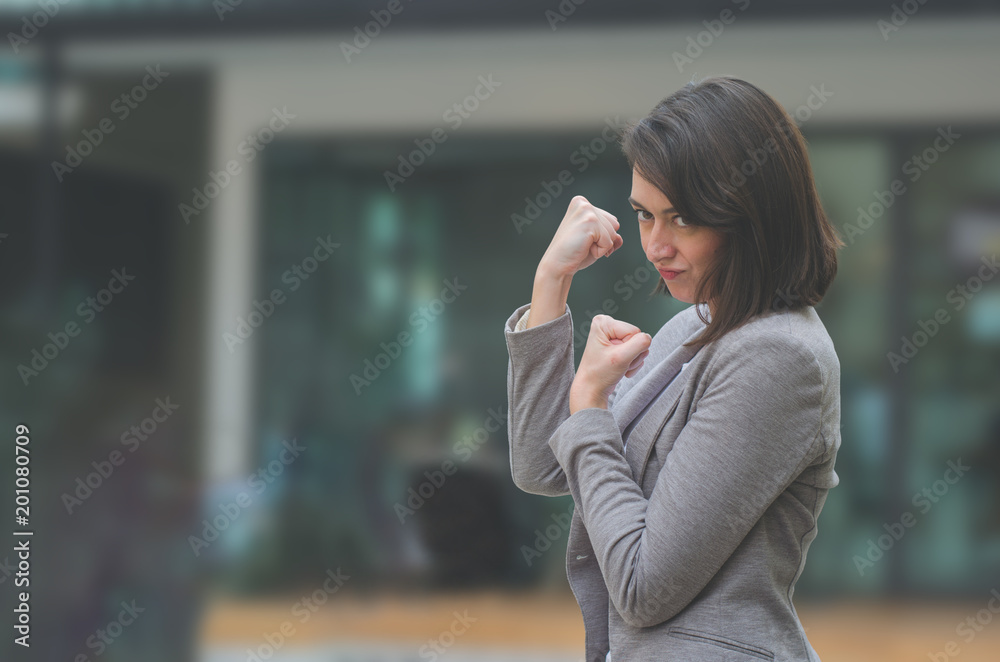 business fighting concept. attractive business woman fist guard ready ...