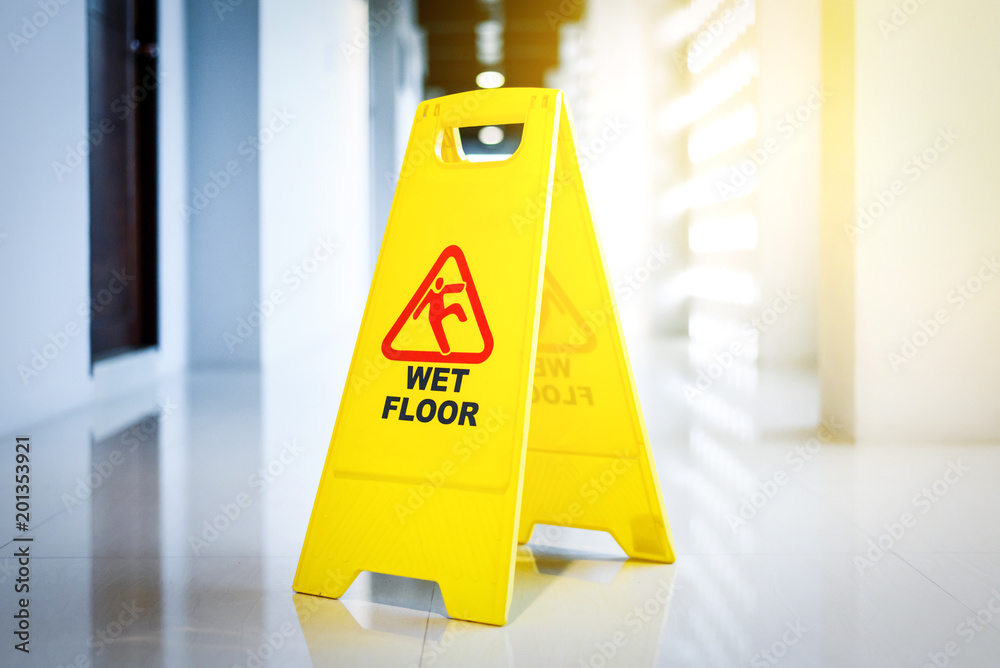 Sign showing warning of wet floor on wet floor Stock Photo | Adobe Stock