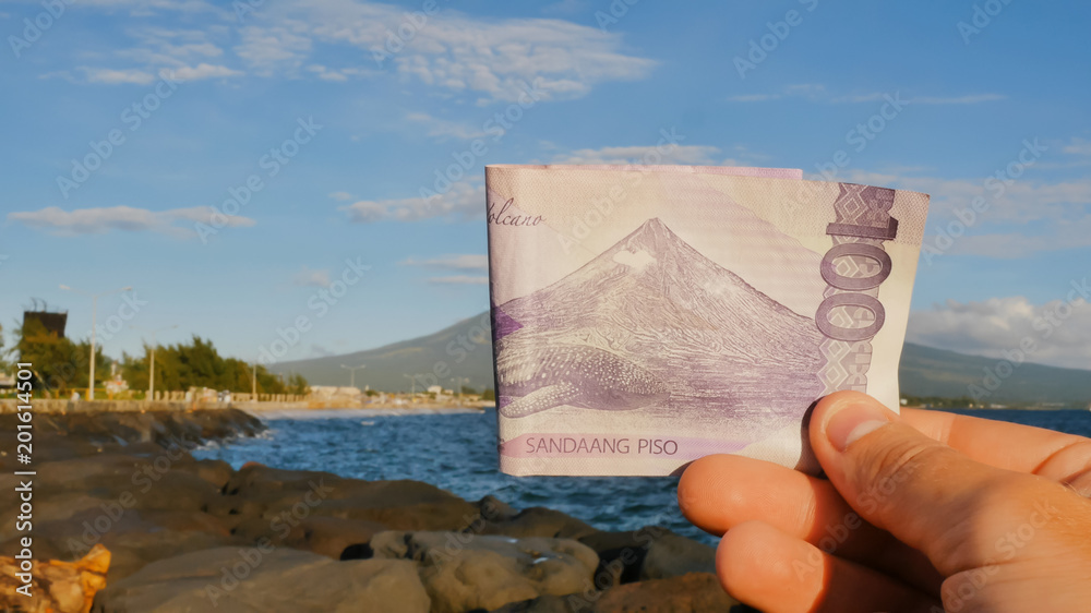 Philippine money. A Filipino monetary note in one hundred pesos is ...