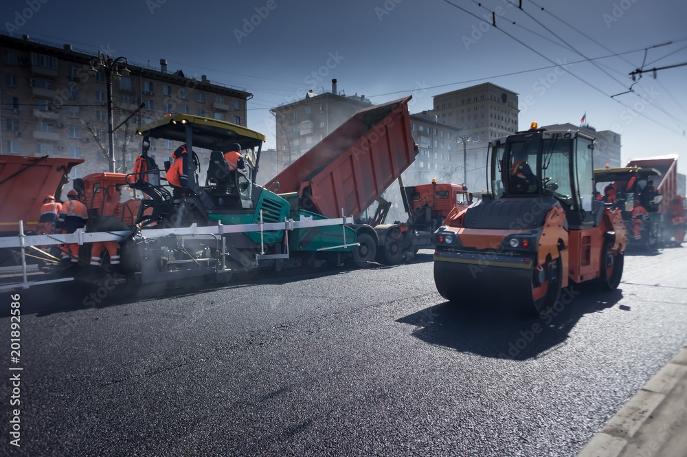 heavy asphalt paver and road vibrating roller seal ready for repair ...