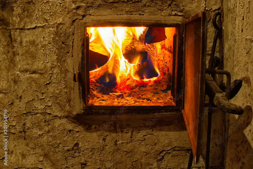 Firewood and fire in the village furnace . Open flapper and rough ...
