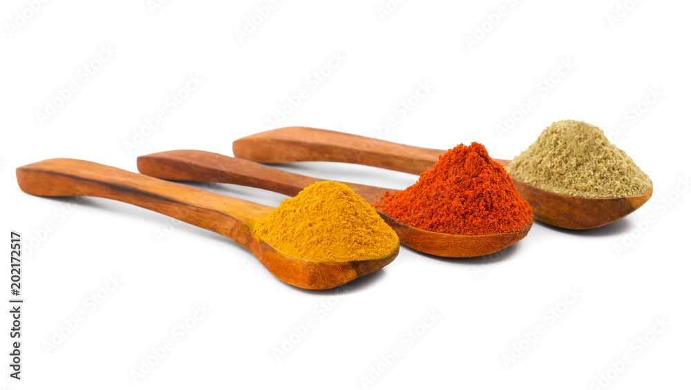 Indian Spices in Wooden Spoons Also Know as Red Chilli Powder, Turmeric ...