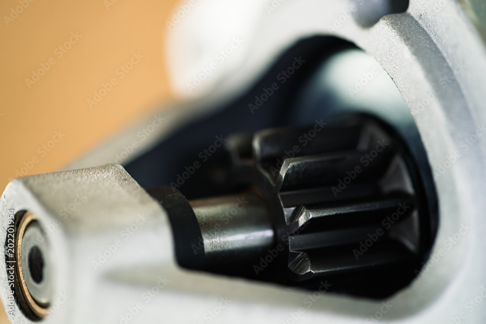 Background image of auto parts with rotor close-up. Big black pinion in ...