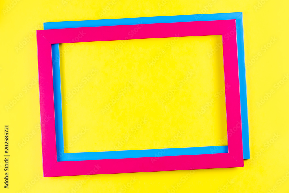 Pink and blue color frame on bright yellow background. Stock Photo ...