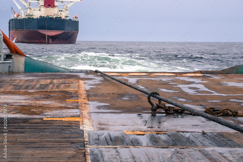 Anchor-handling Tug Supply AHTS vessel during dynamic positioning ...