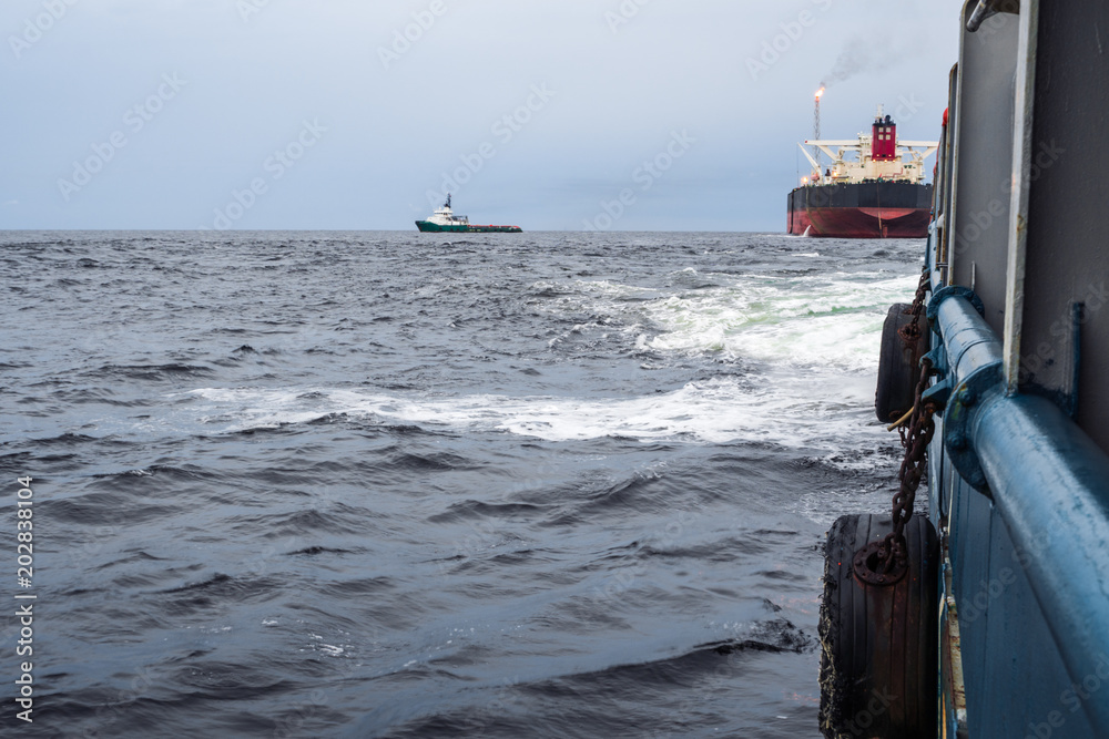 View from deck of AHTS ocean tug doing tanker lifting static towing ...