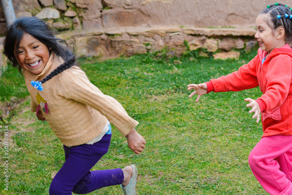 Happy latin kids playing in the countryside. Stock Photo | Adobe Stock