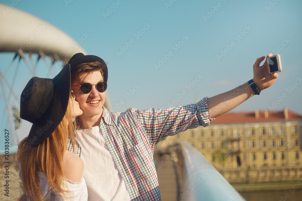 Couple smile on bridge. Tourist having fun on sumer travel adventure ...
