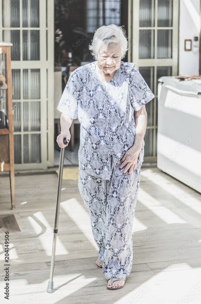 Portrait of a obaasan (grandma) with difficulty to walk because of the ...