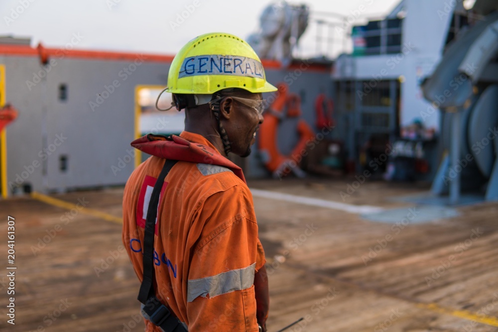 Stockfoto Seaman AB or Bosun on deck of offshore vessel or ship ...