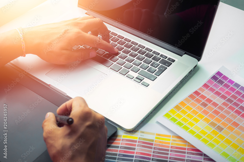 designer hand working with new modern computer laptop and pro digital ...