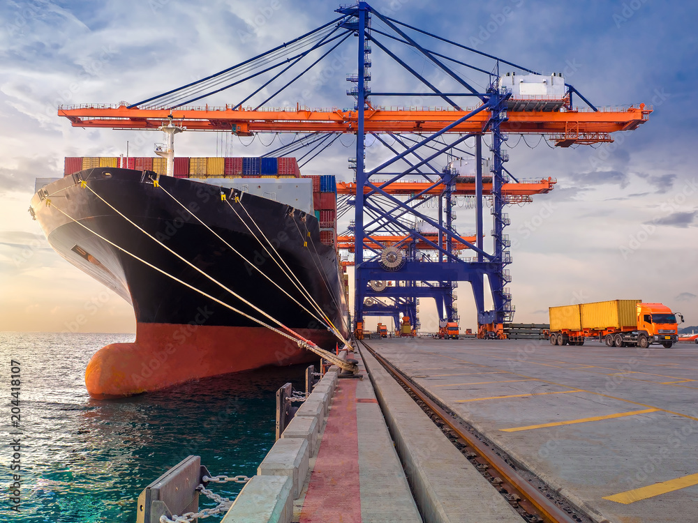The container vessel during discharging at an industrial port and move ...