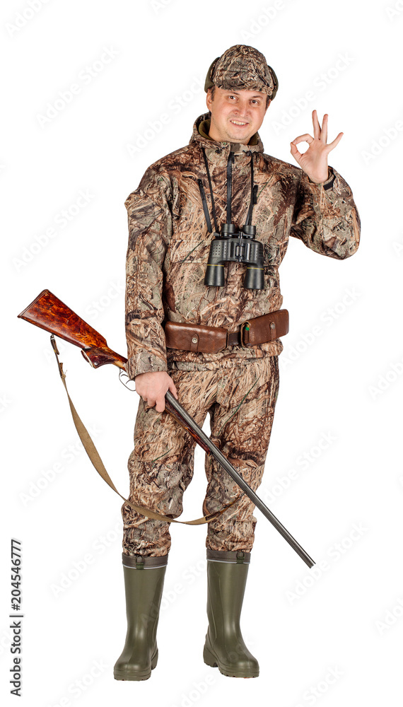 Full length portrait of a male hunter with double barreled shotgun ...