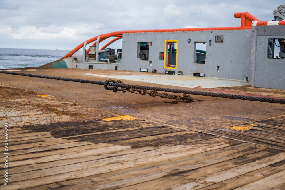Anchor-handling Tug Supply AHTS vessel during towing .Ocean tug job ...