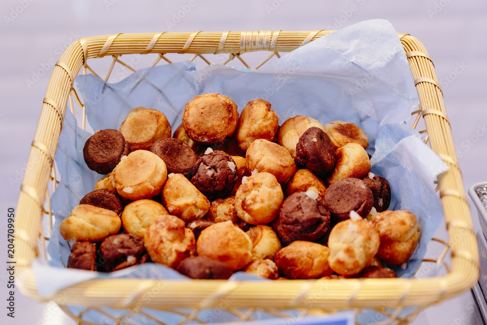 Mini eclairs balls made by white flour and chocolate flour inside ...