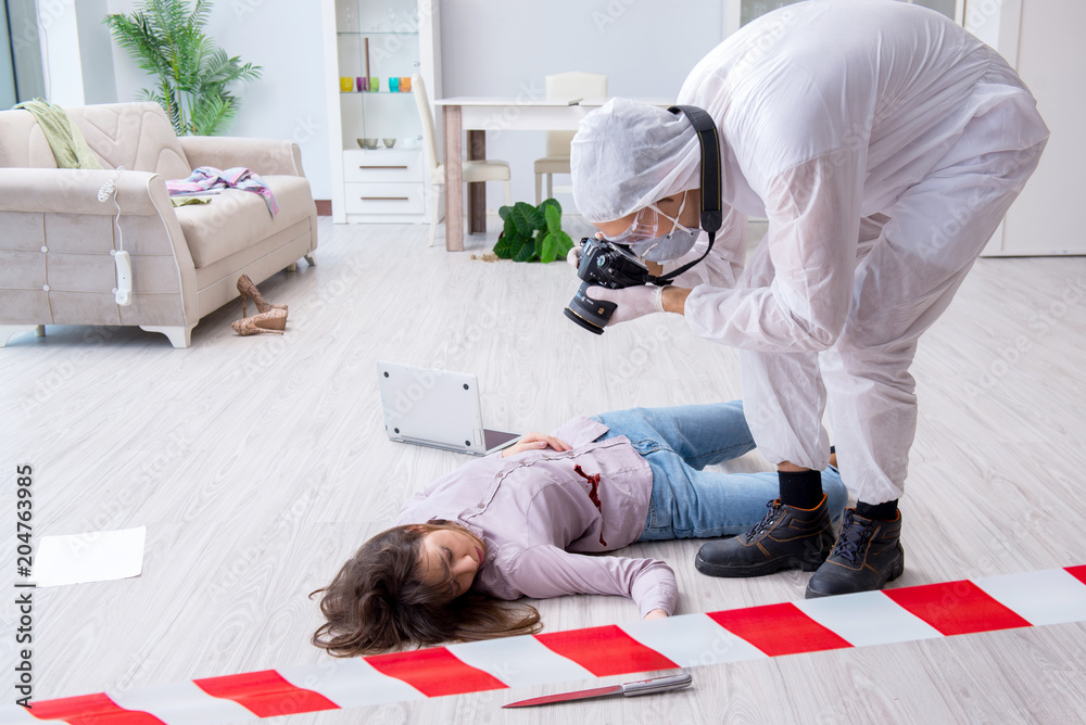 Forensic investigator at the crime scene investigating woman mur Stock Photo | Adobe Stock