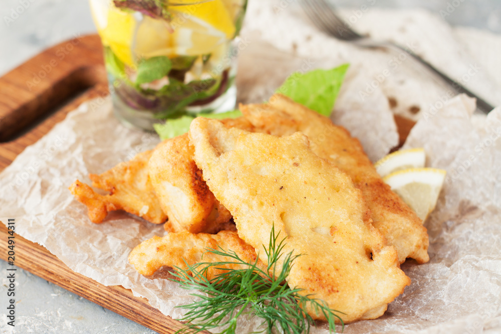 Battered fish with lemon Stock Photo | Adobe Stock
