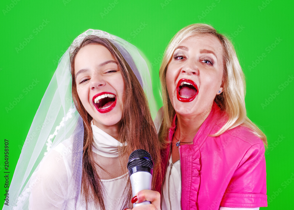 Young Singer bride and her sister with a microphone celebrating her ...