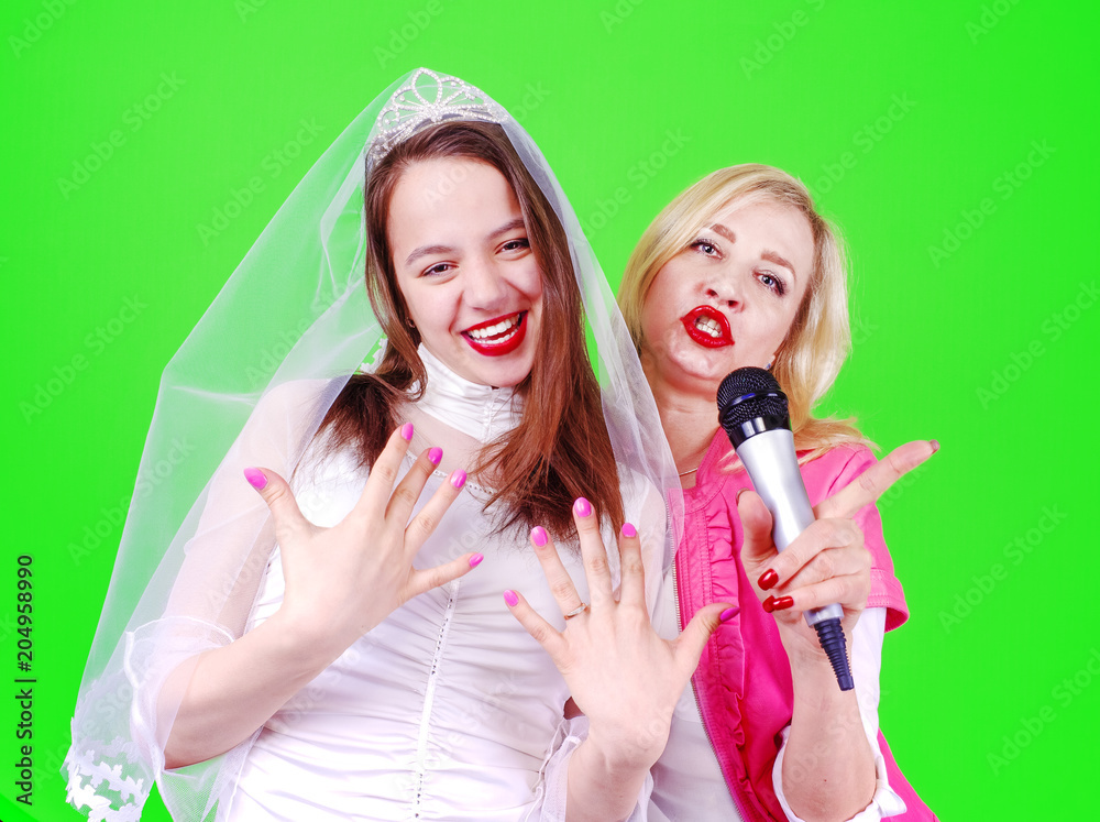 Young Singer bride and her sister with a microphone celebrating her ...