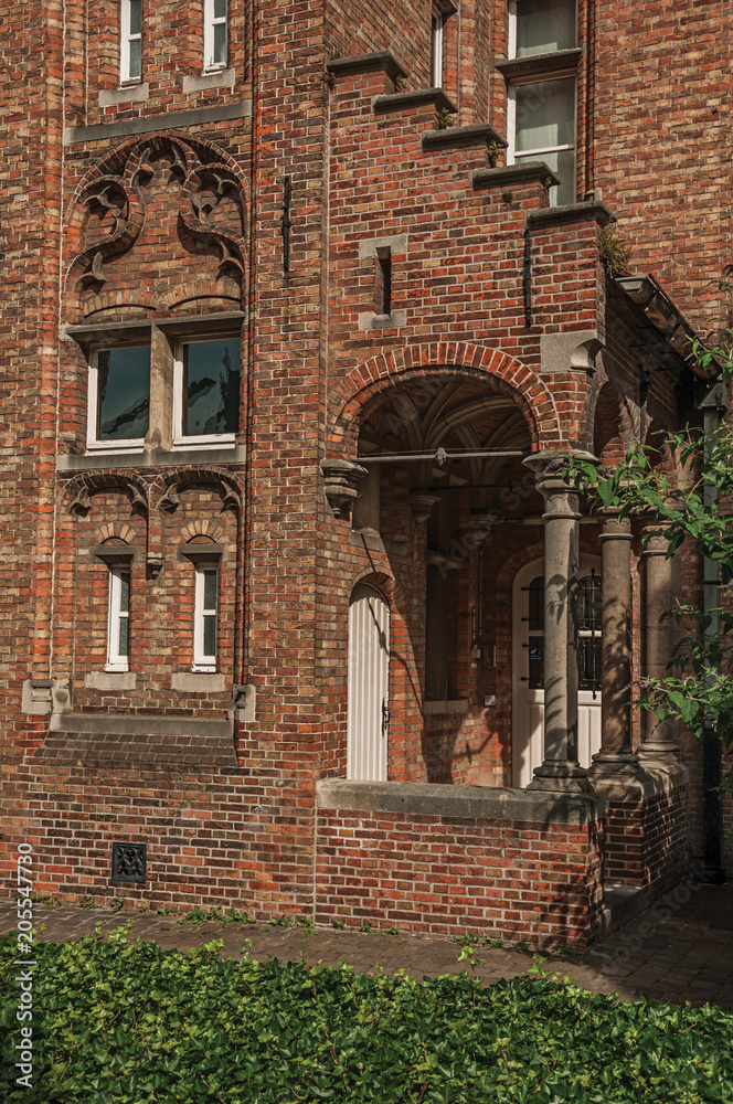 Brick facade of house in typical style of the Flanders’s region and ...