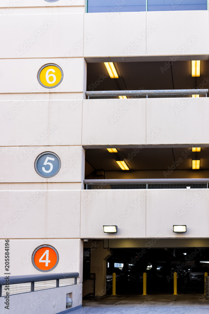 Retail department store mall parking garage vertical view with colorful ...