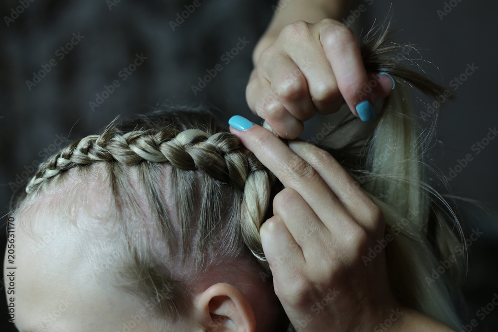 girl with blonde hair, process of braiding braids with kanekalon ...