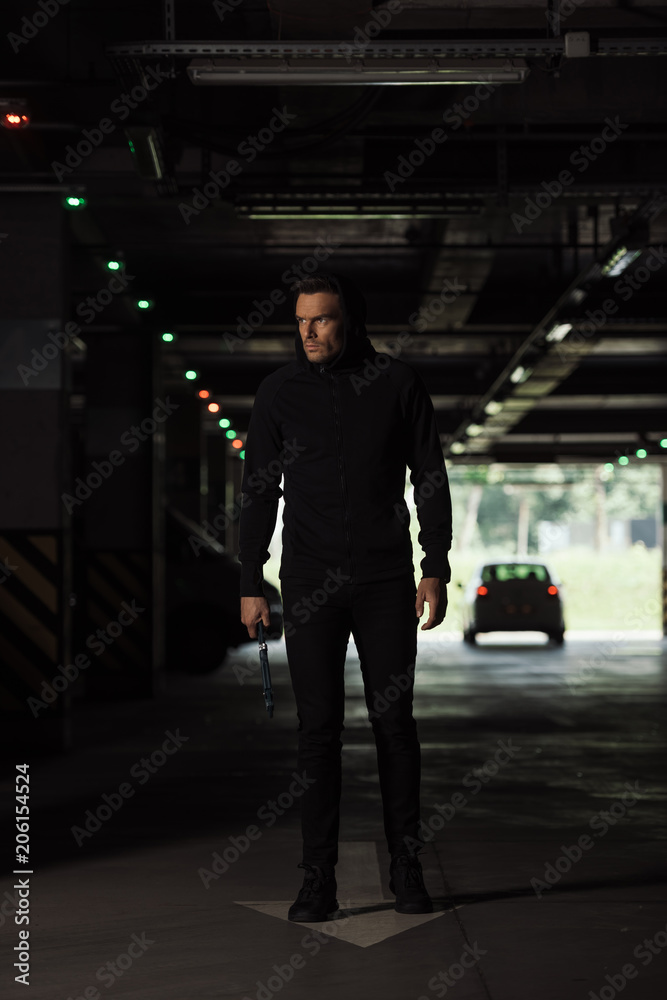 male robber in black hoodie standing with pair of nippers Stock Photo ...