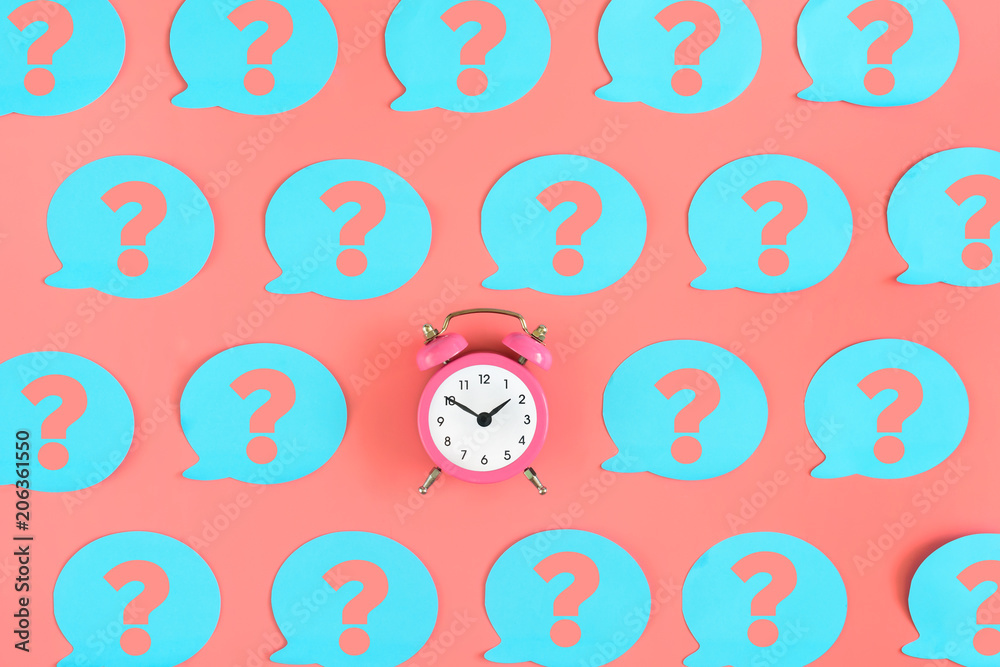 Many pink stickers with question marks are on the pink background. In ...