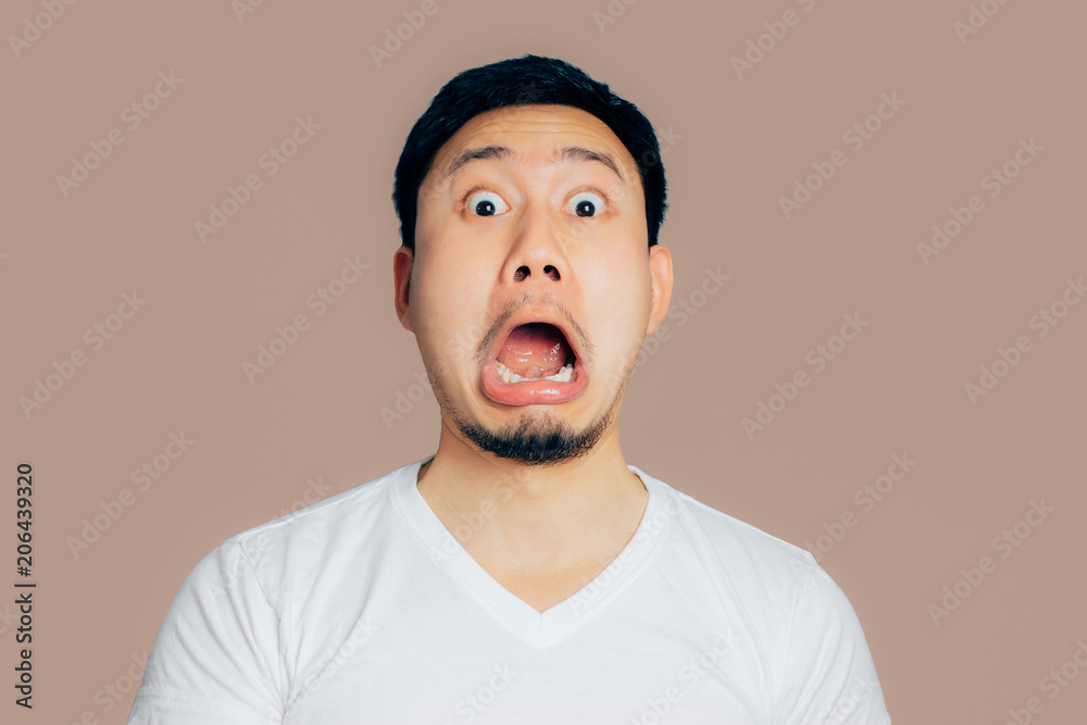 Asian man with surprised and shocked face. Stock Photo | Adobe Stock