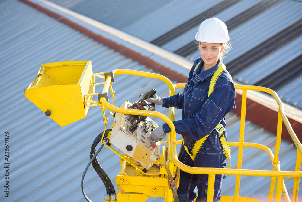 female construction worker on site in hydraulic lifting ramp Stock ...