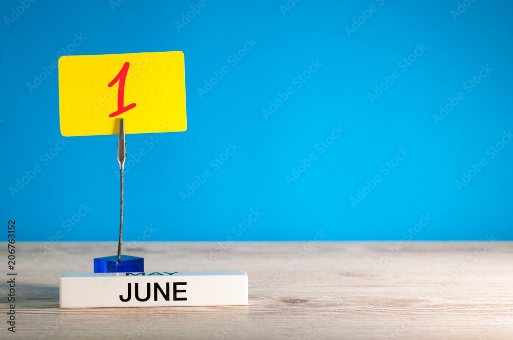 June 1st. Day 1 of june month, calendar on table with blue background ...