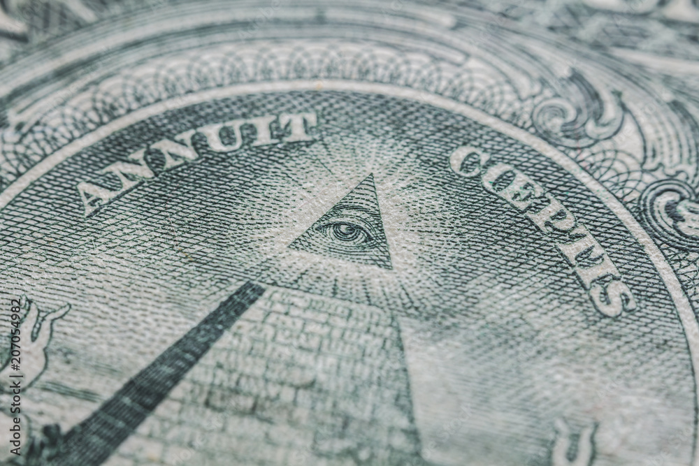 A detail of a one dollar bill. It is seen the famous "illuminati ...