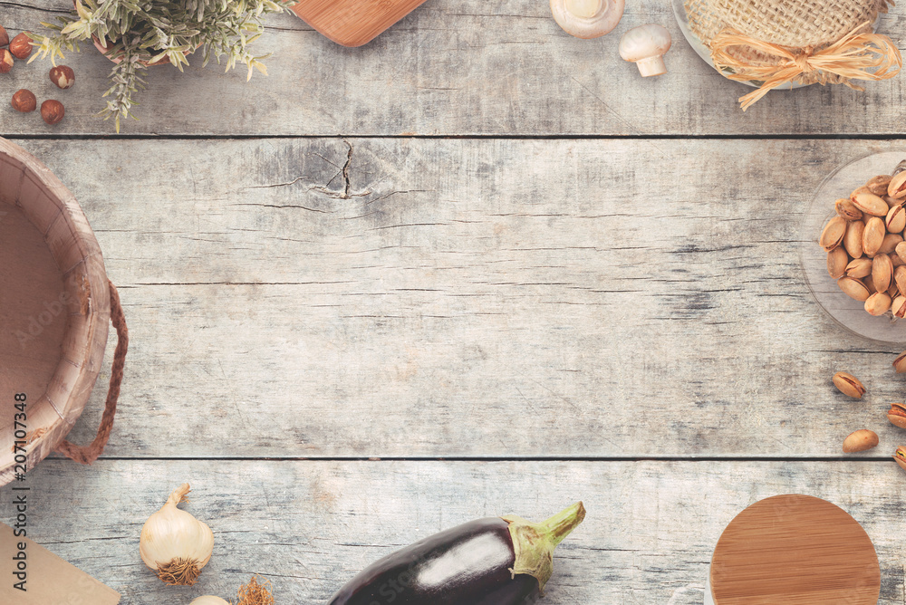 Old vintage style kitchen table with cooking ingredients. Copy space in ...