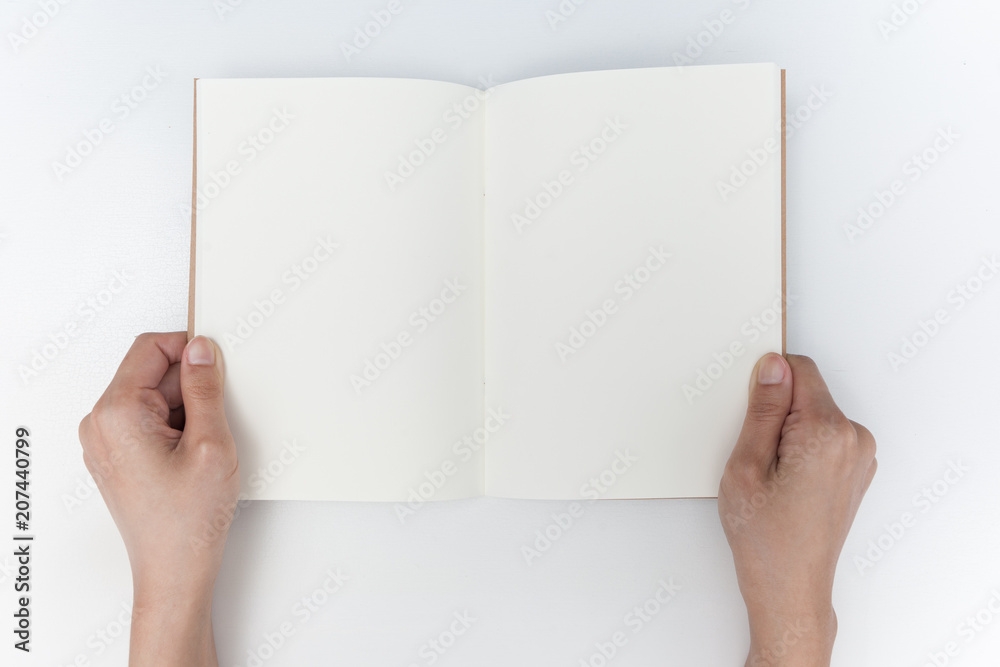 hand holding open page with empty paper note book isolated white ...