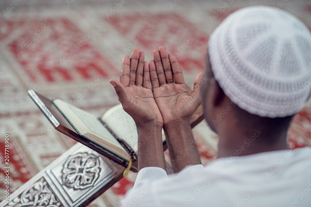 African Muslim Man Making Traditional Prayer To God While Wearing ...