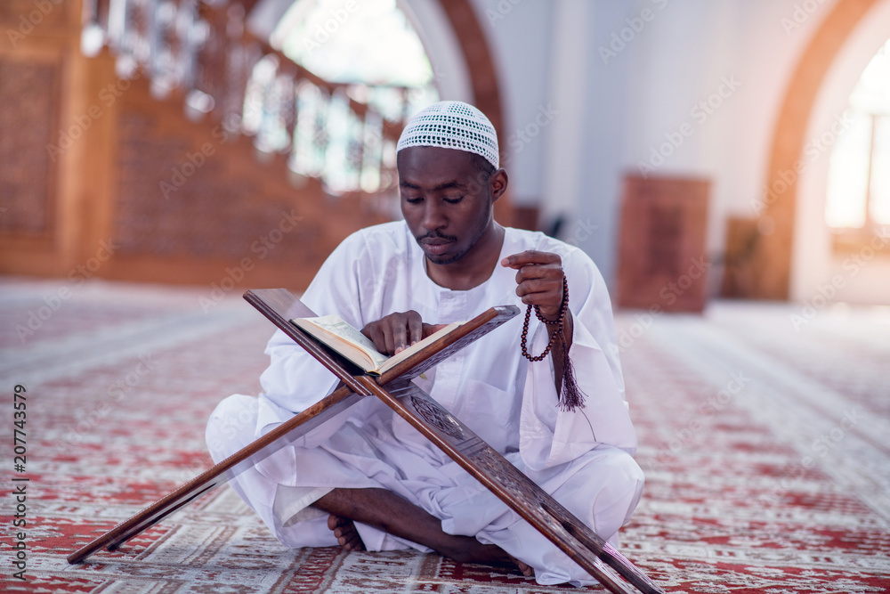 African Muslim Man Making Traditional Prayer To God While Wearing ...