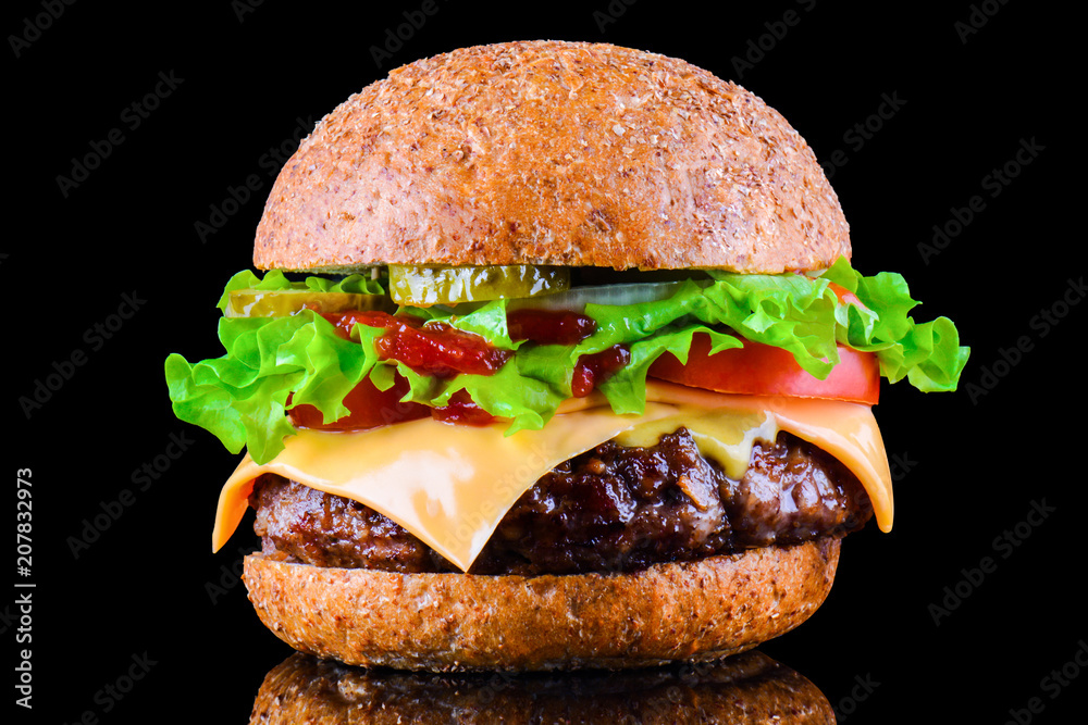 Big tasty hamburger or cheeseburger on black background with grilled ...