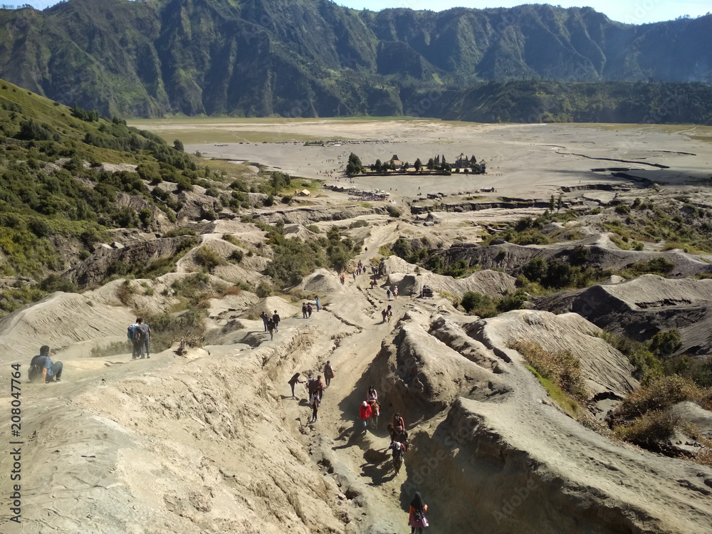 Tourist walking to hiking Mount Bromo, The active Mount Bromo of the ...