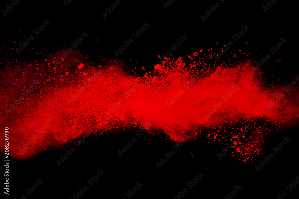 Abstract explosion of red dust on black background. Abstract red powder ...