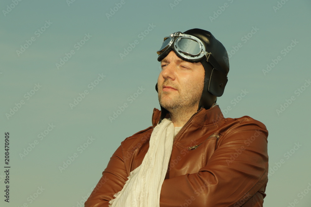 Vintage pilot with leather cap, scarf and aviator glasses - Portrait of ...