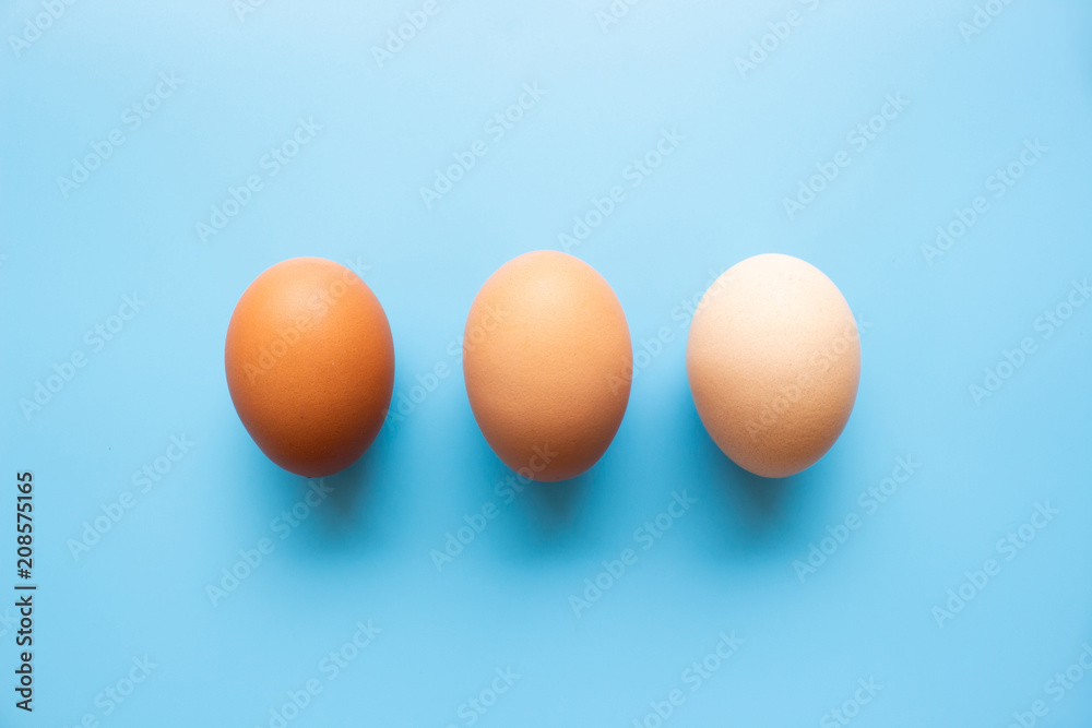 Eggs skin tone color dark to bright on blue background. Example for ...