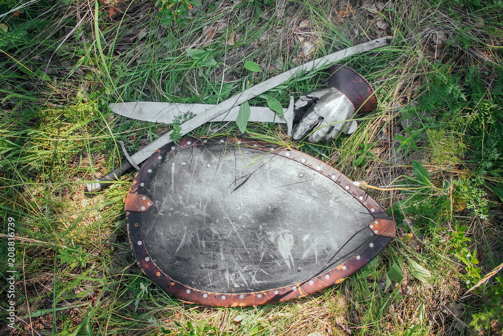 Saber, sword and Shield of the Mongolian soldier lie on the ground in ...