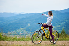 Female Cyclist Pointing Free Stock Photo - Public Domain Pictures
