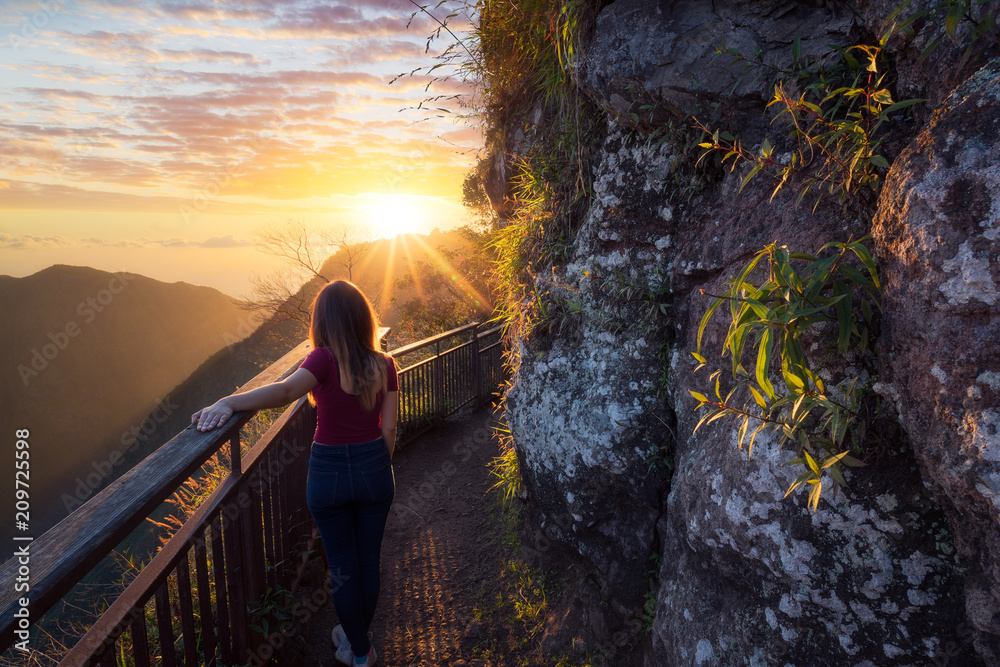 Girl watching the sunset at Cap Noir, Dos D'Ane, La Possession, Reunion Island Stock Photo ...