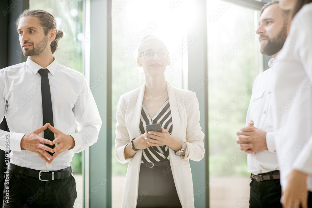 Business people strictly dressed in white having a conversation ...