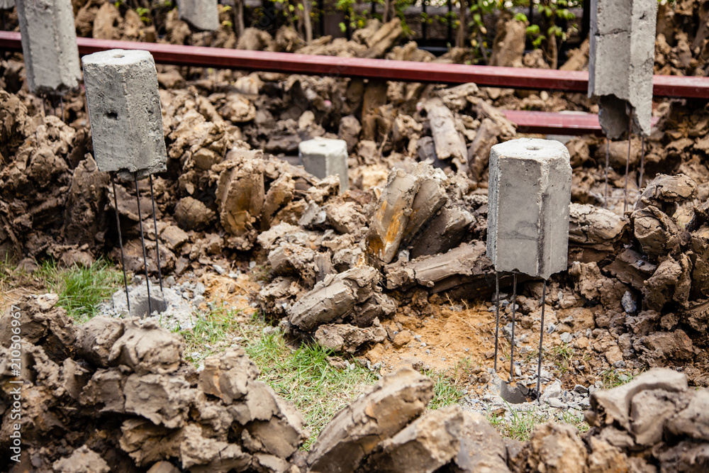 Foundation concrete pile with steel bar inside cut off the ground as ...