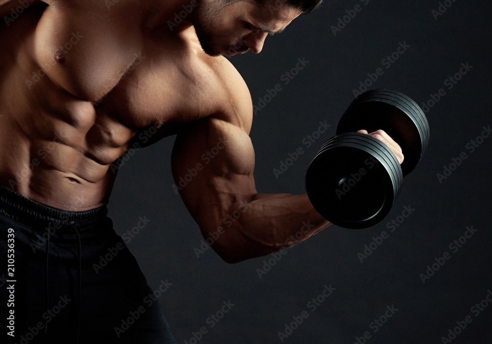Frontview of strong bodybuilder with clear muscular relief lifting ...