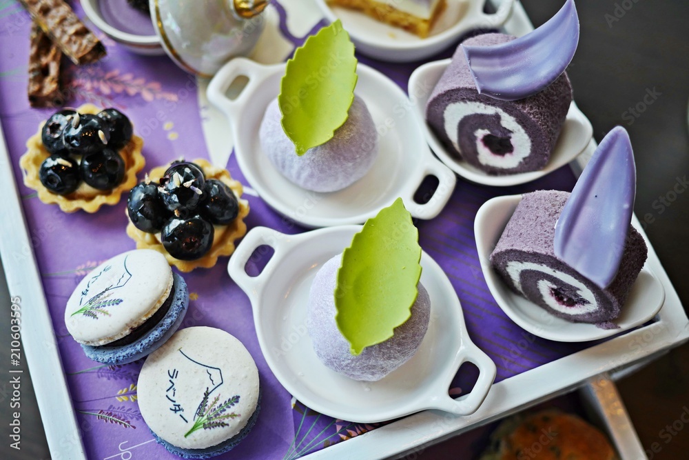 A colorful and delicious set of afternoon tea party in lavender theme ...