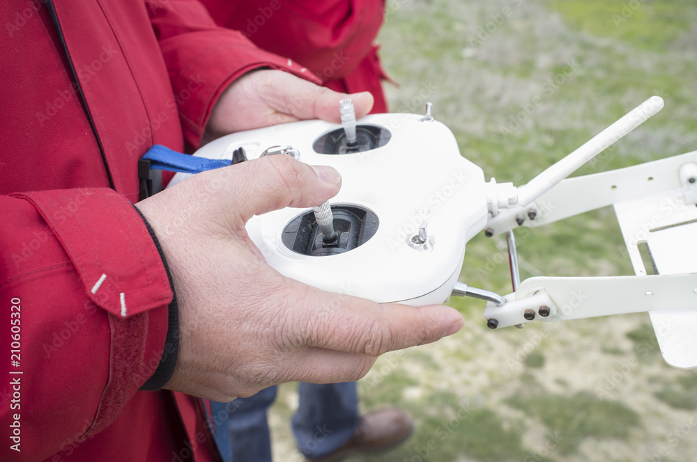 Right control stick for throttle. Pilot maneuver dron on remote ...